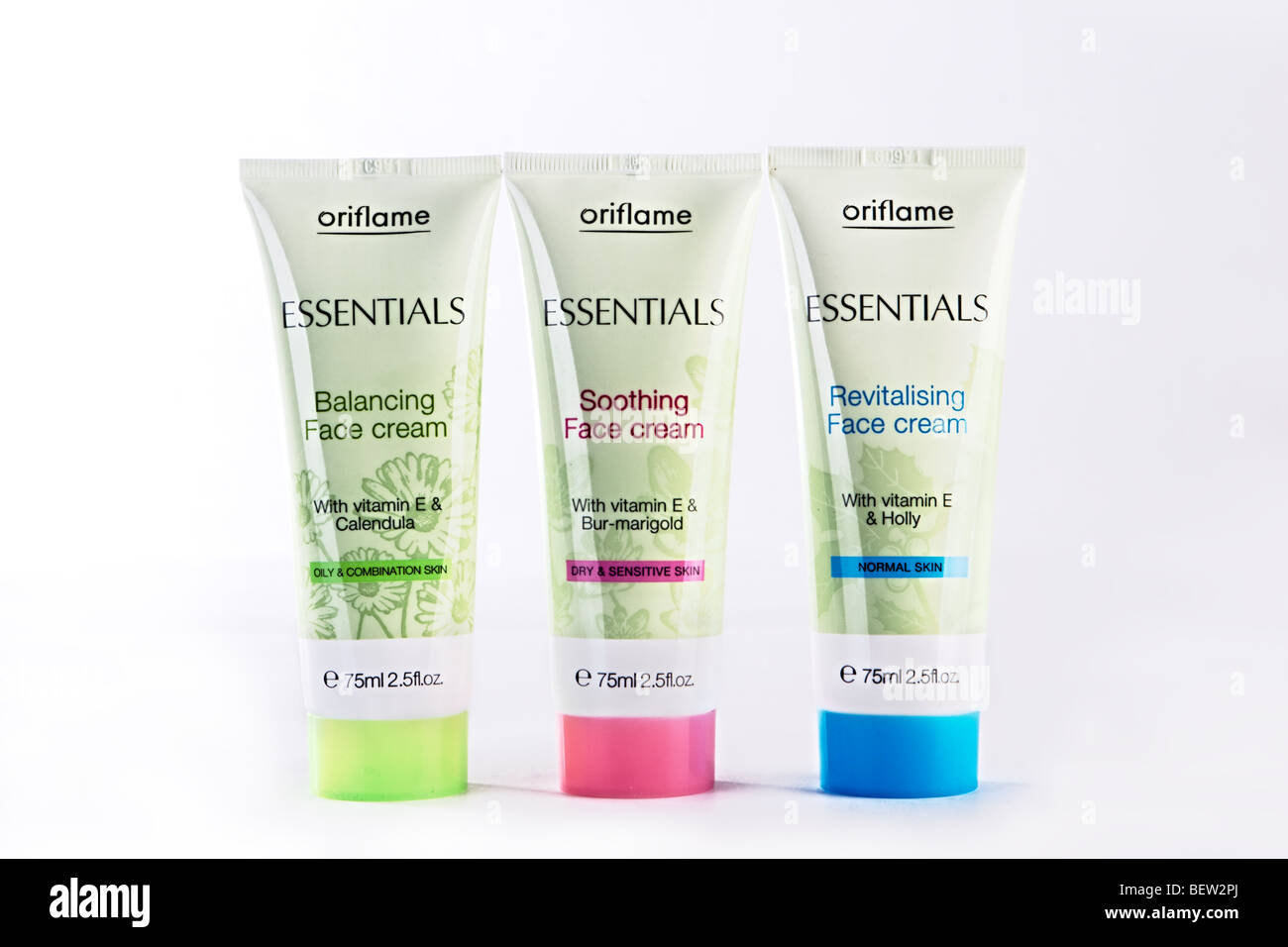 Three bottle with essential creams for different types of face skin ...