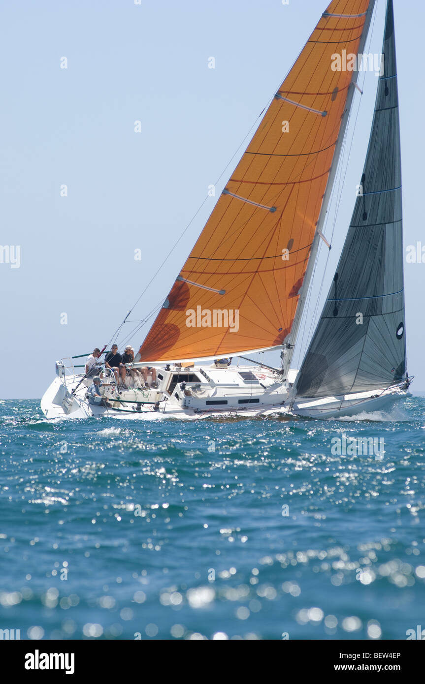 Yacht with yellow sail competes in team sailing event, California Stock ...