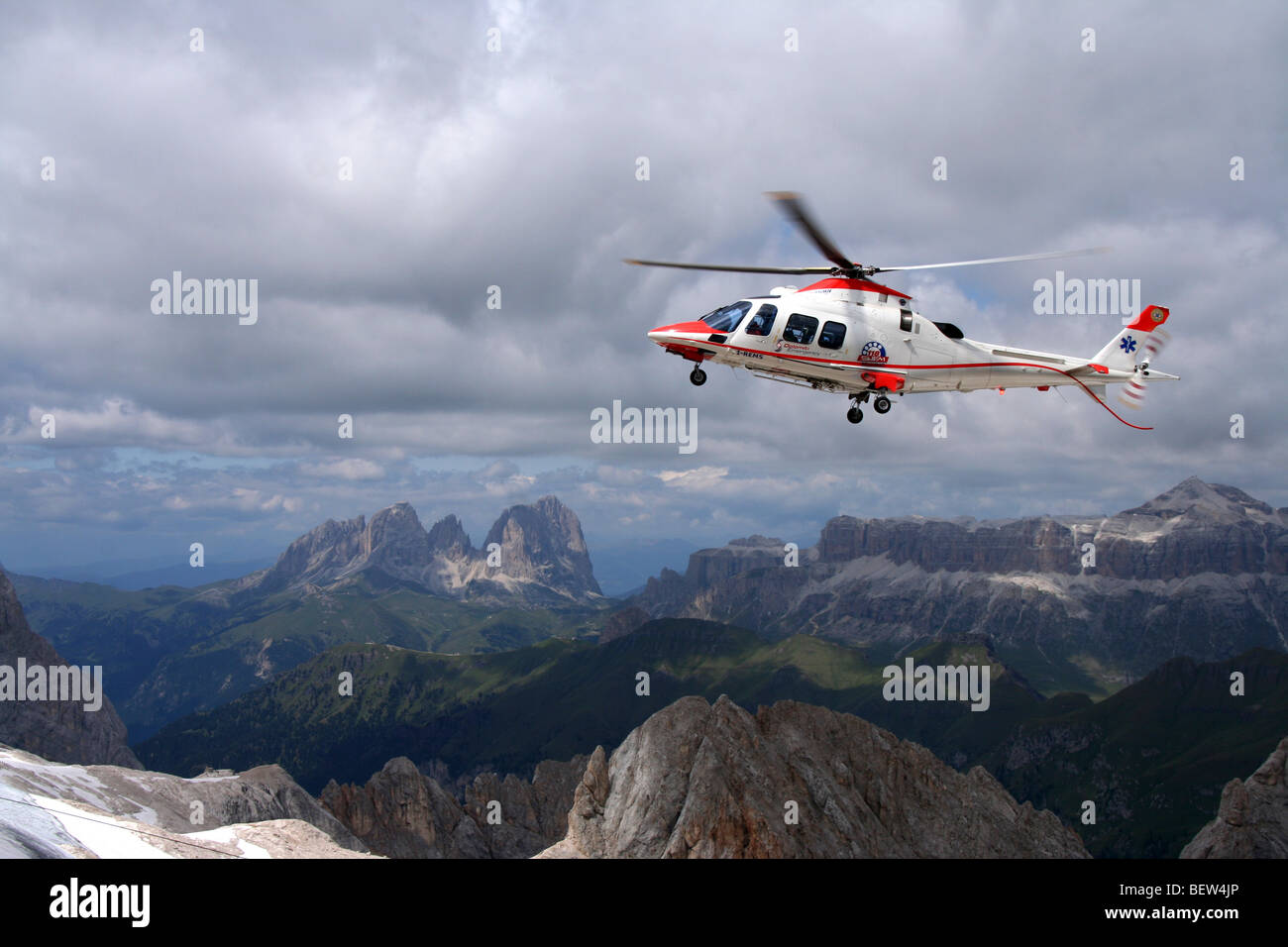 Rescue helicopter on the Marmolada mountain, Italian Dolomites, Italy ...