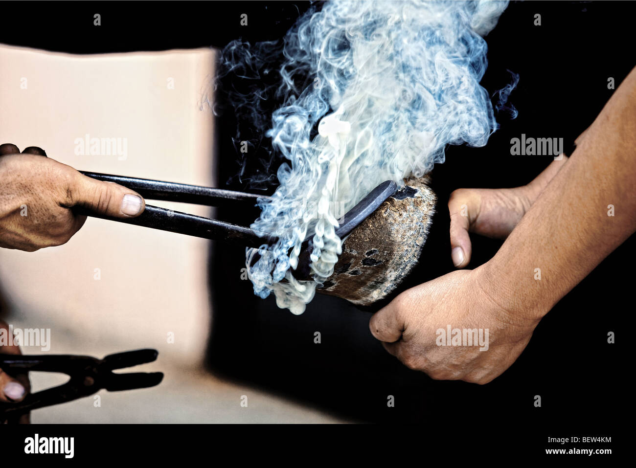 Blacksmith making horseshoes Stock Photo - Alamy