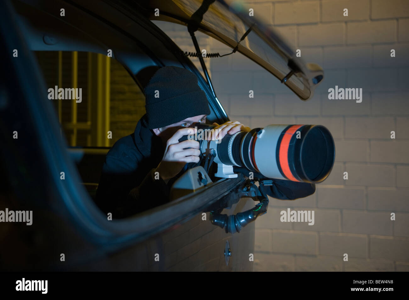 Paparazzi photographer in car Stock Photo - Alamy