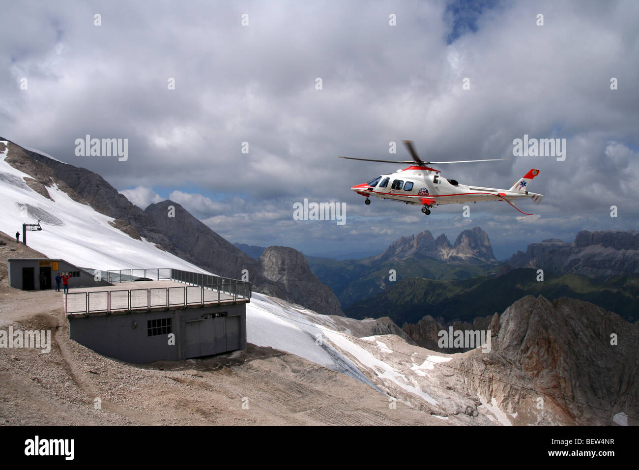 Rescue helicopter on the Marmolada mountain, Italian Dolomites, Italy ...
