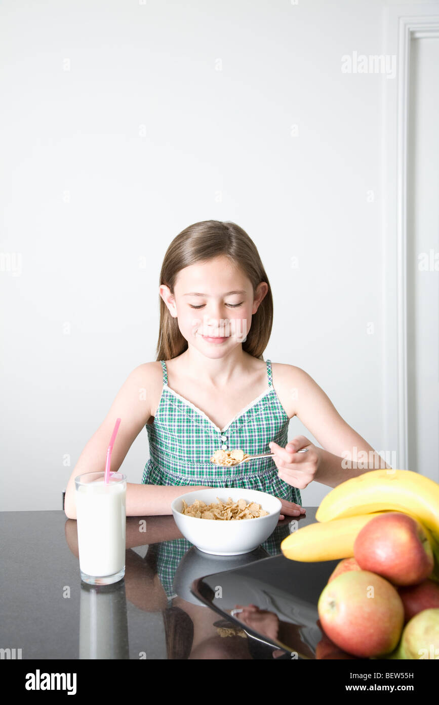 Teen girl having breakfast Stock Photo - Alamy