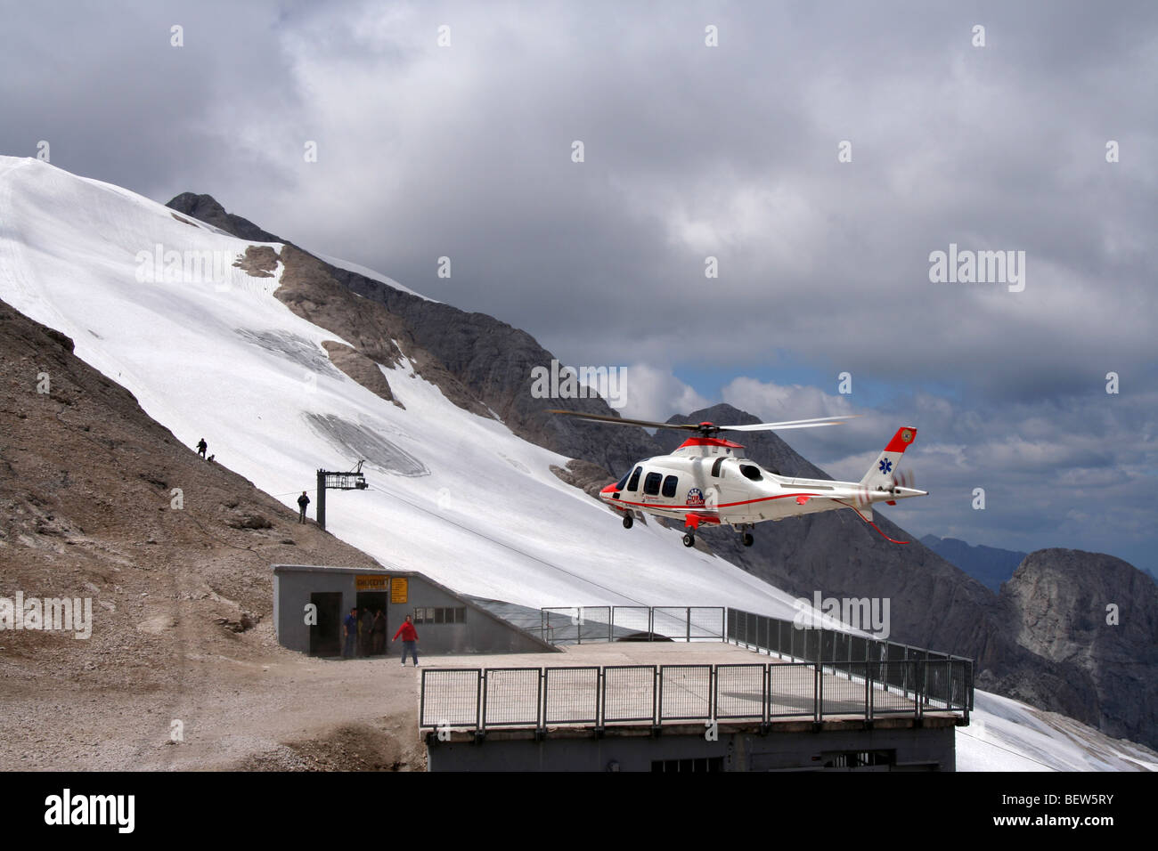 Rescue helicopter on the Marmolada mountain, Italian Dolomites, Italy ...