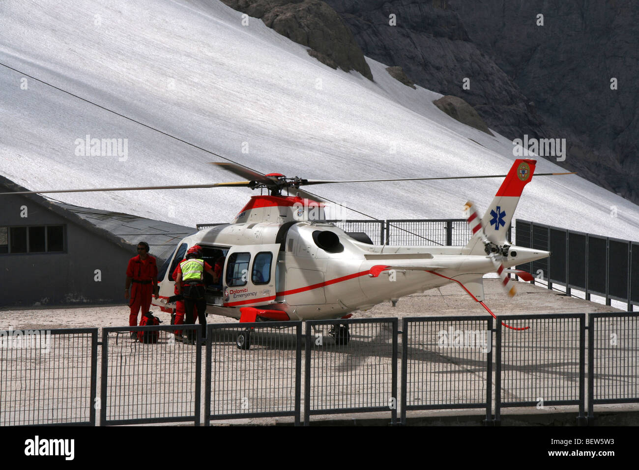 Rescue helicopter on the Marmolada mountain, Italian Dolomites, Italy ...