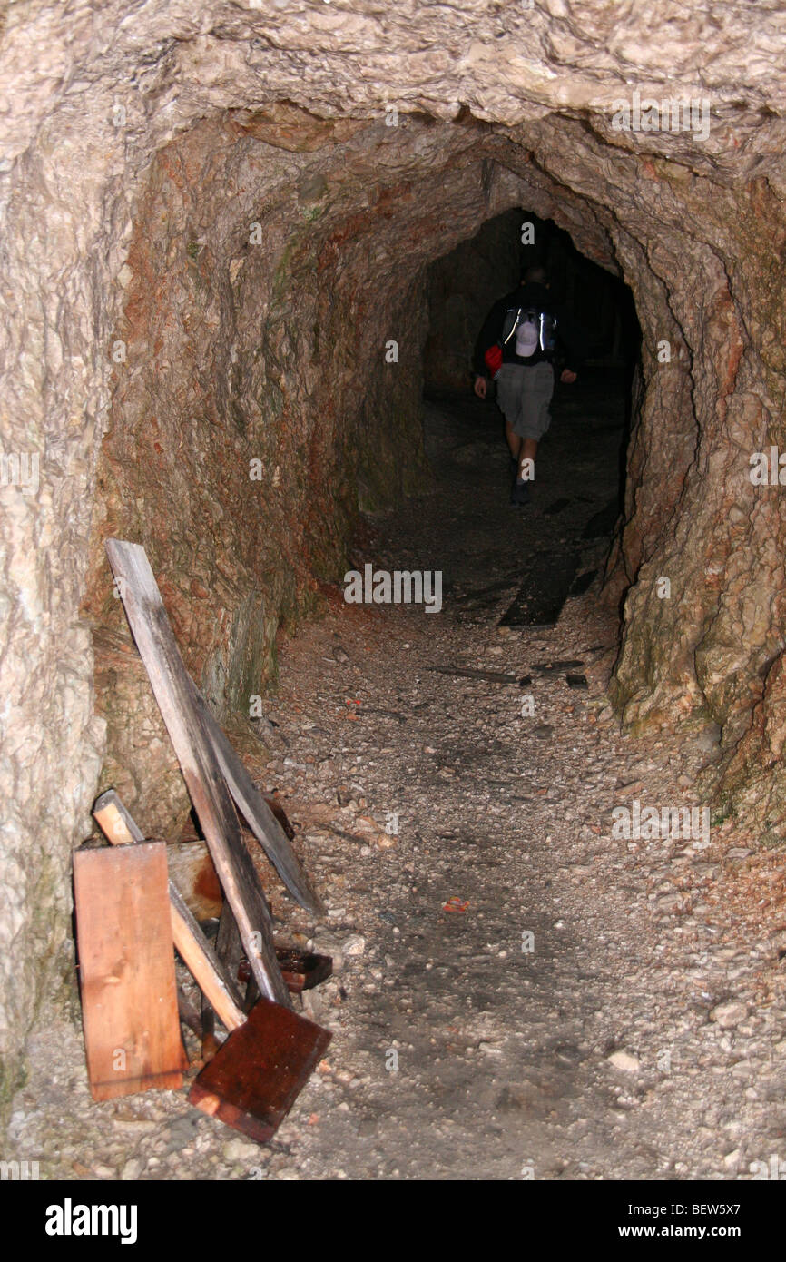man exploring a tunnel from World War One on the Marmolada, Italian ...