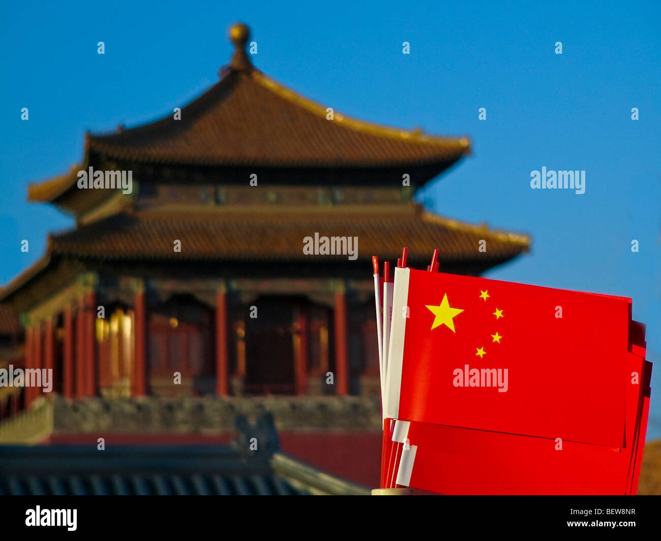 Chinese flags with traditional building in the background, Beijing ...