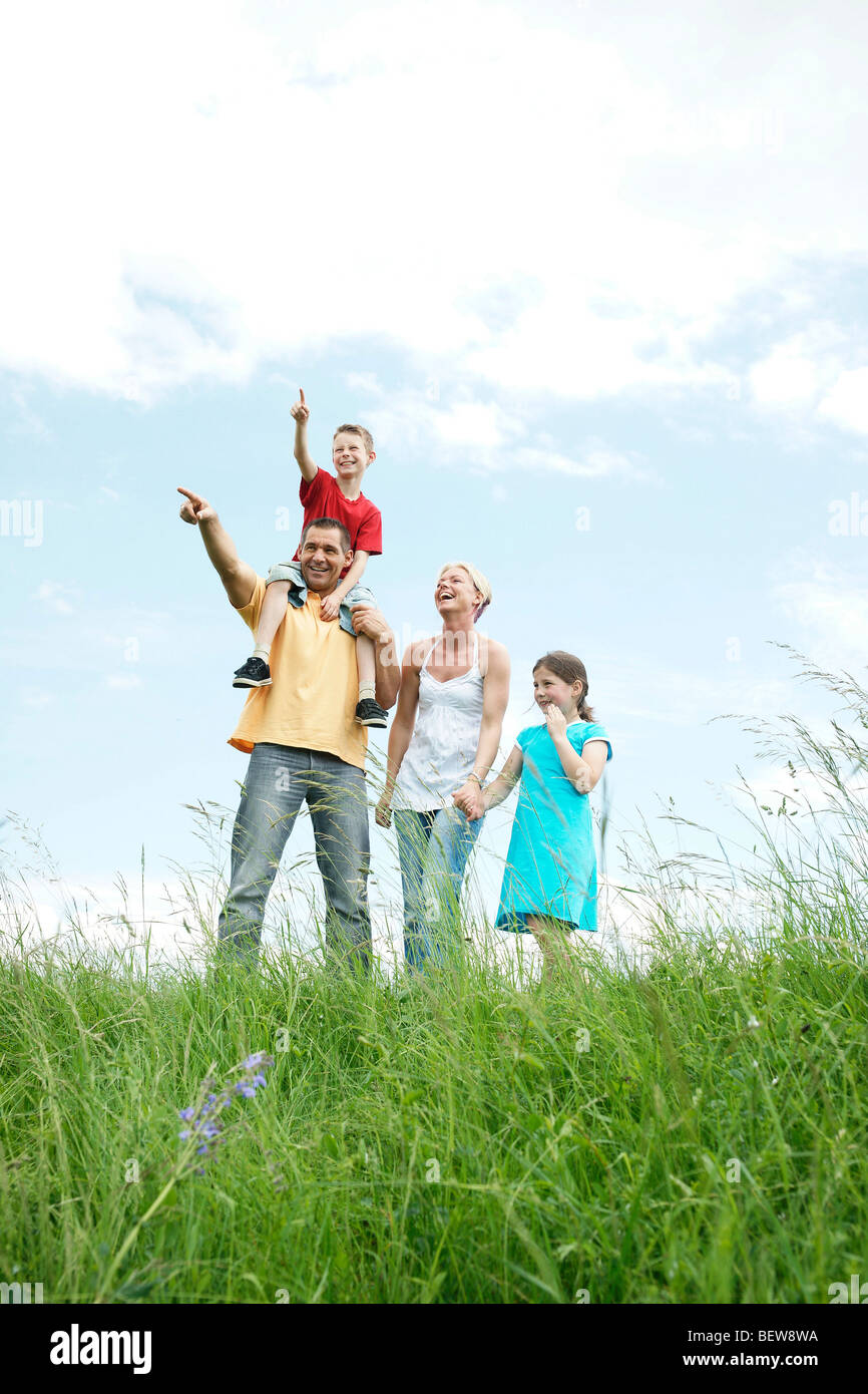 Family on a meadow, low angle view Stock Photo - Alamy