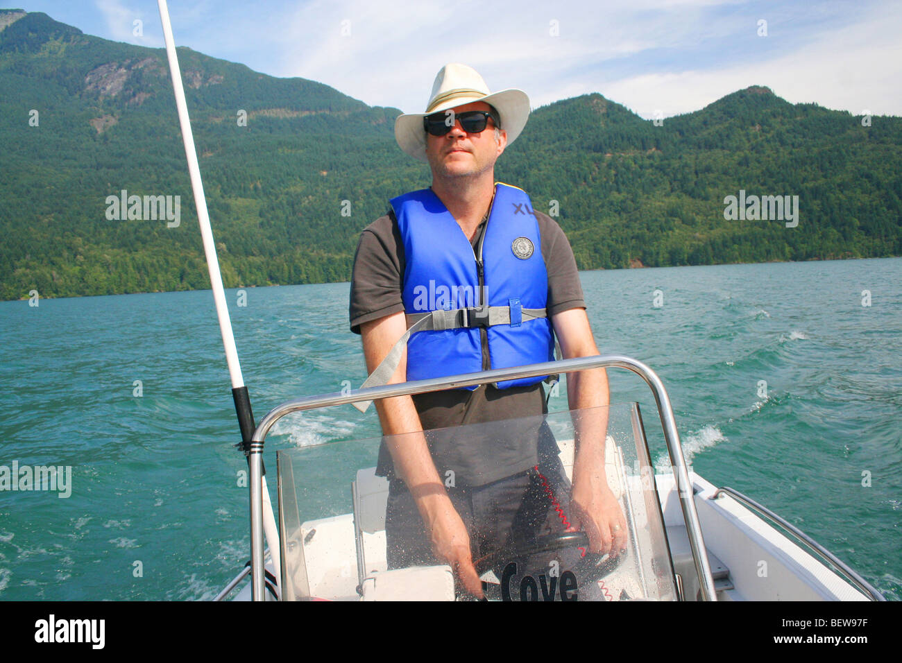 man driving speedboat Stock Photo - Alamy