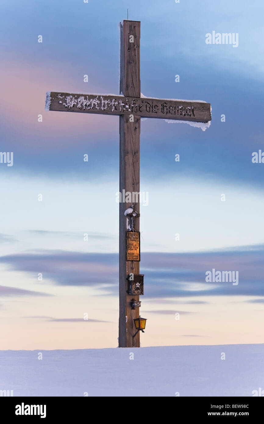 Cross on the summit of a mountain positioned in the snow, Salzburger ...