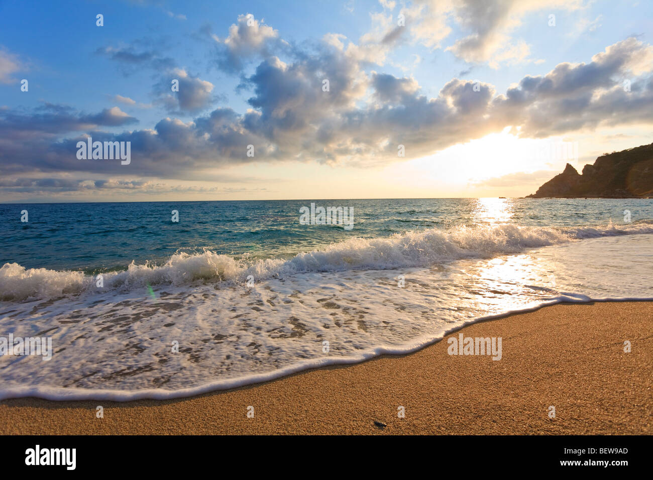 Sunset at the beach, volcano in the background, Tropea, Italy Stock ...