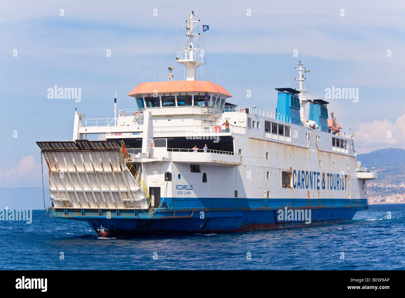Ferry on the sea, coast in the background Stock Photo - Alamy