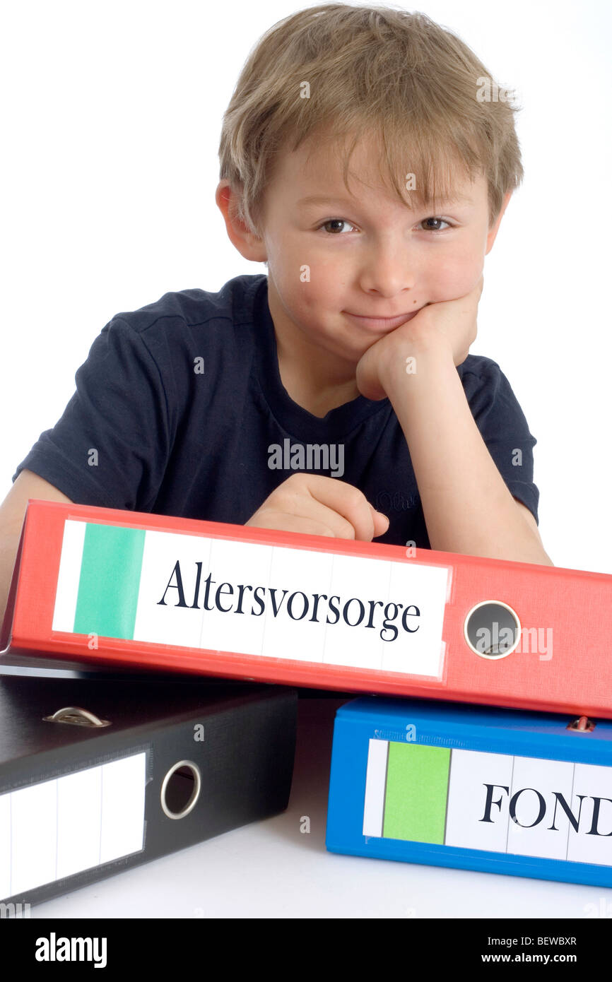 Boy with a pile of files Stock Photo - Alamy