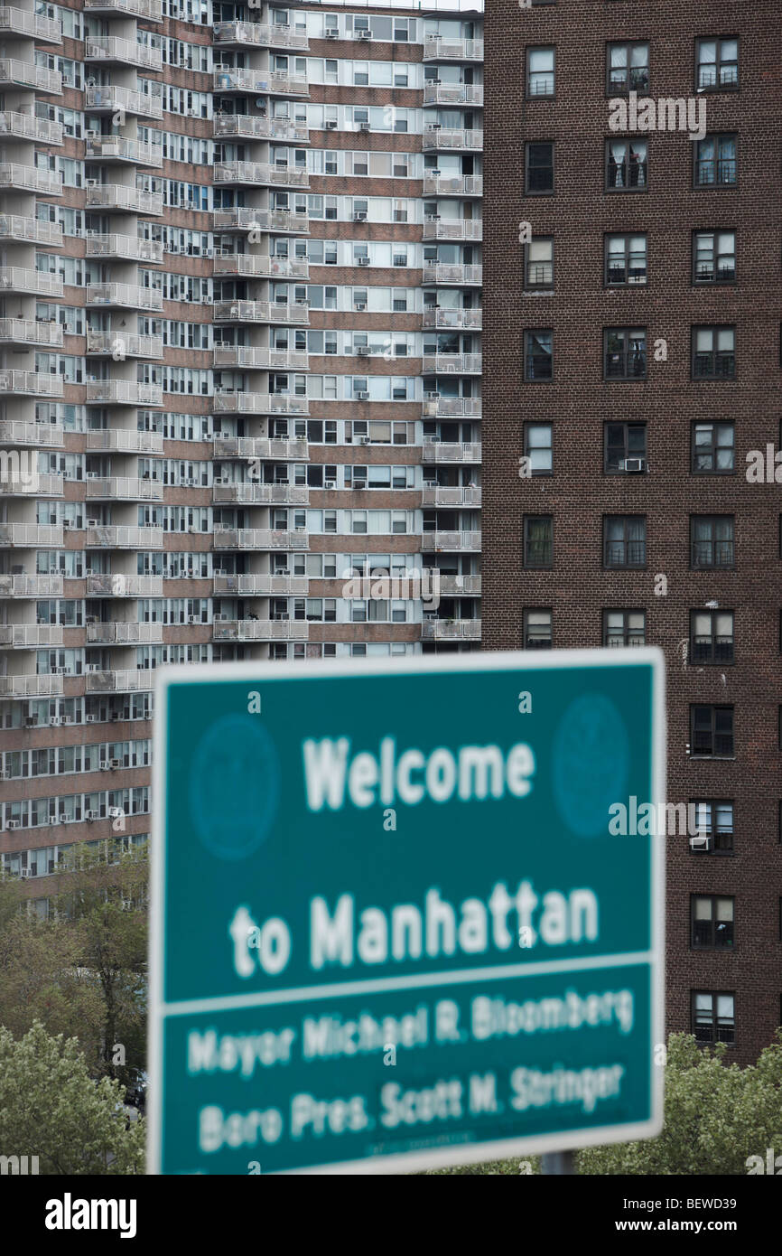 Welcome sign in front of shabby apartment buildings, New York City, USA ...