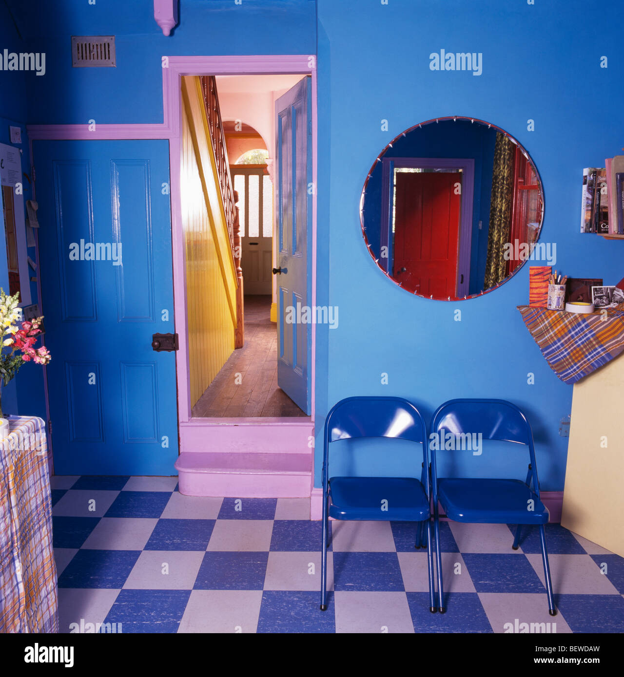 Circular mirror and blue+white chequer-board floor in small bright blue ...