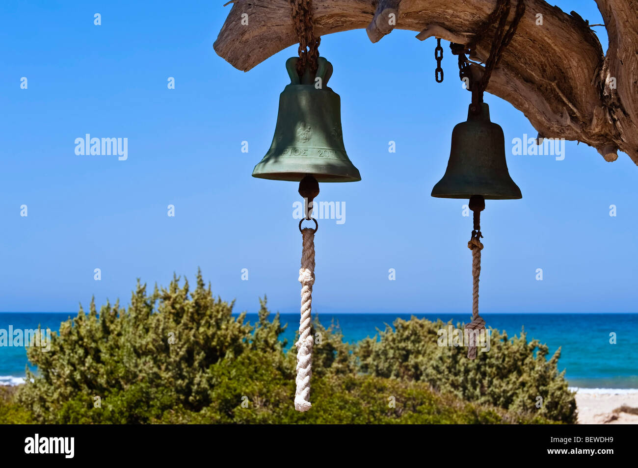 Two bells hanging on a limb of a tree, Cos, Greece Stock Photo - Alamy