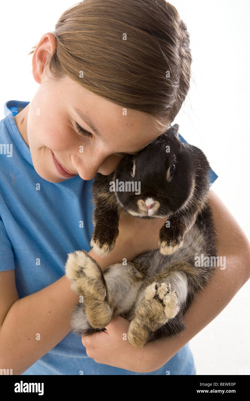 Child holding rabbit hi-res stock photography and images - Alamy
