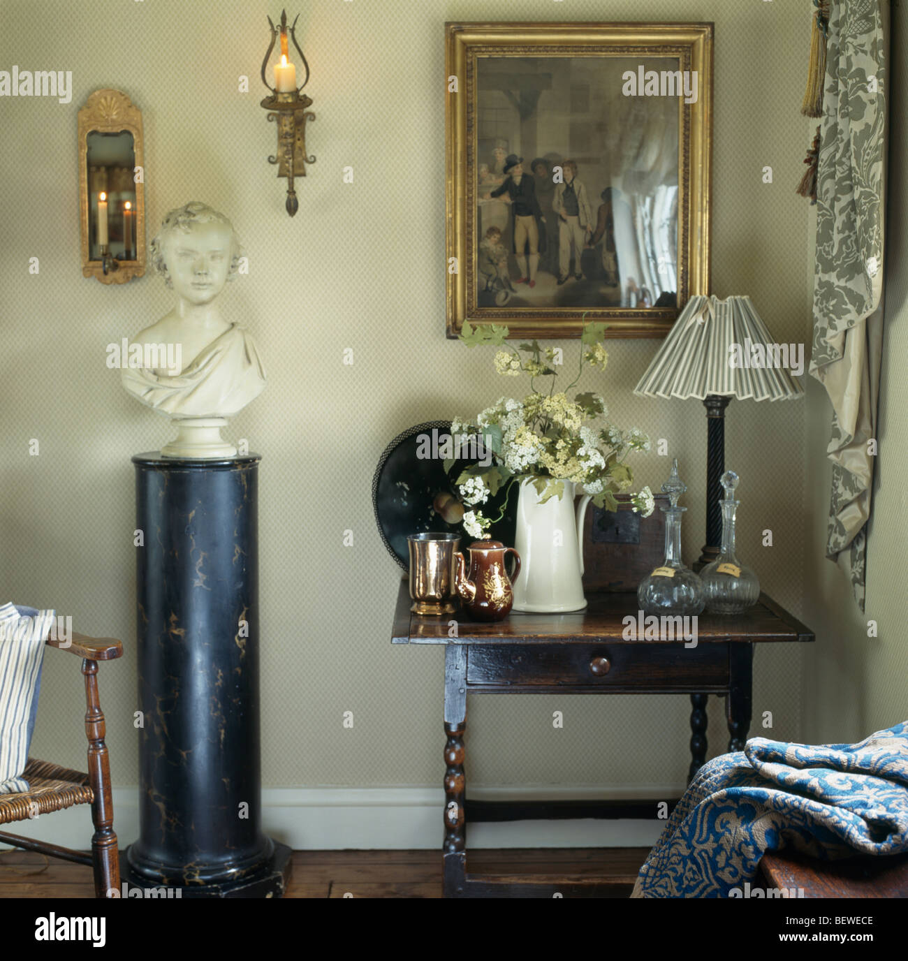 Classical bust on black marble pedestal in country dining room with ...