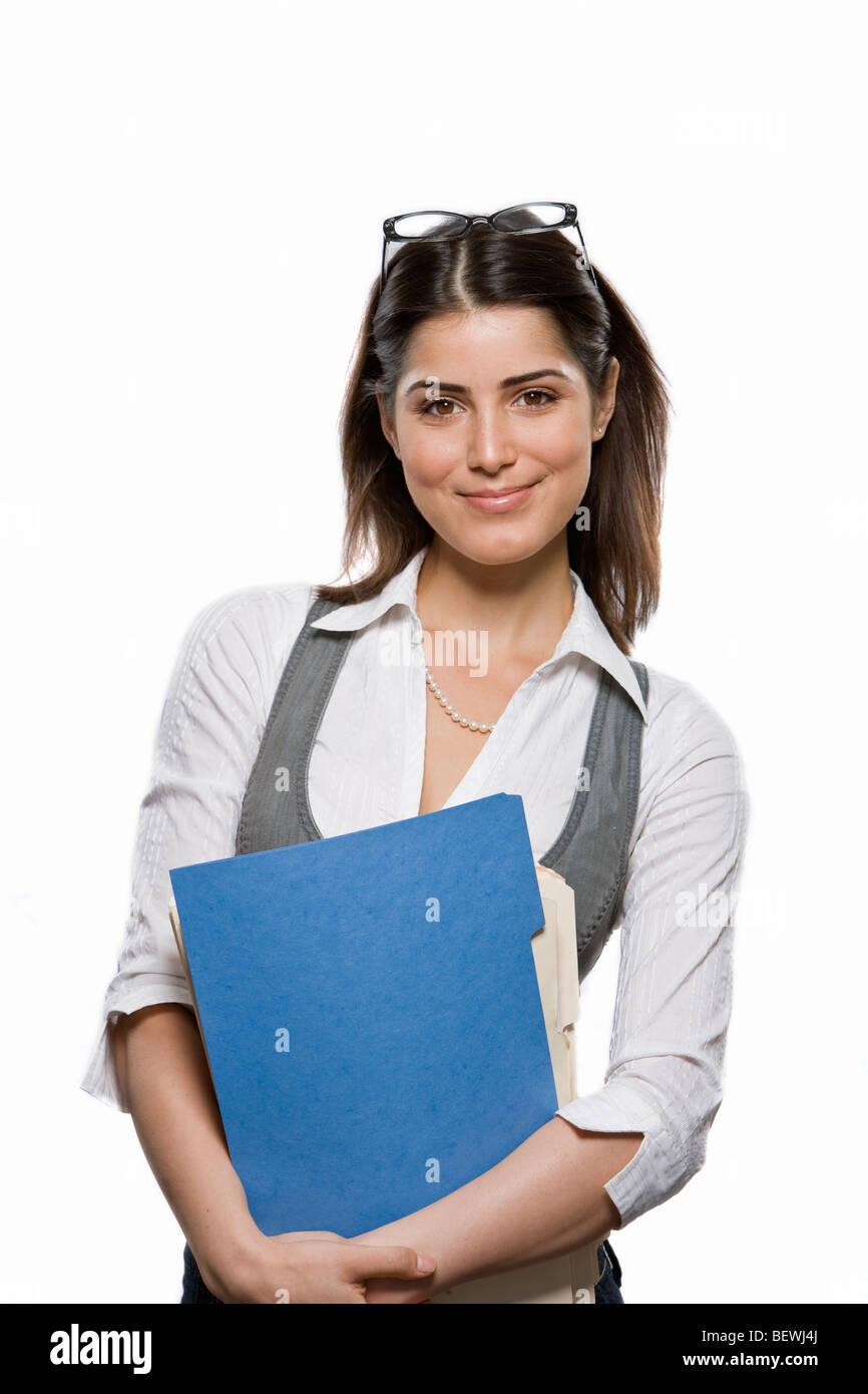 University student holding books Stock Photo - Alamy