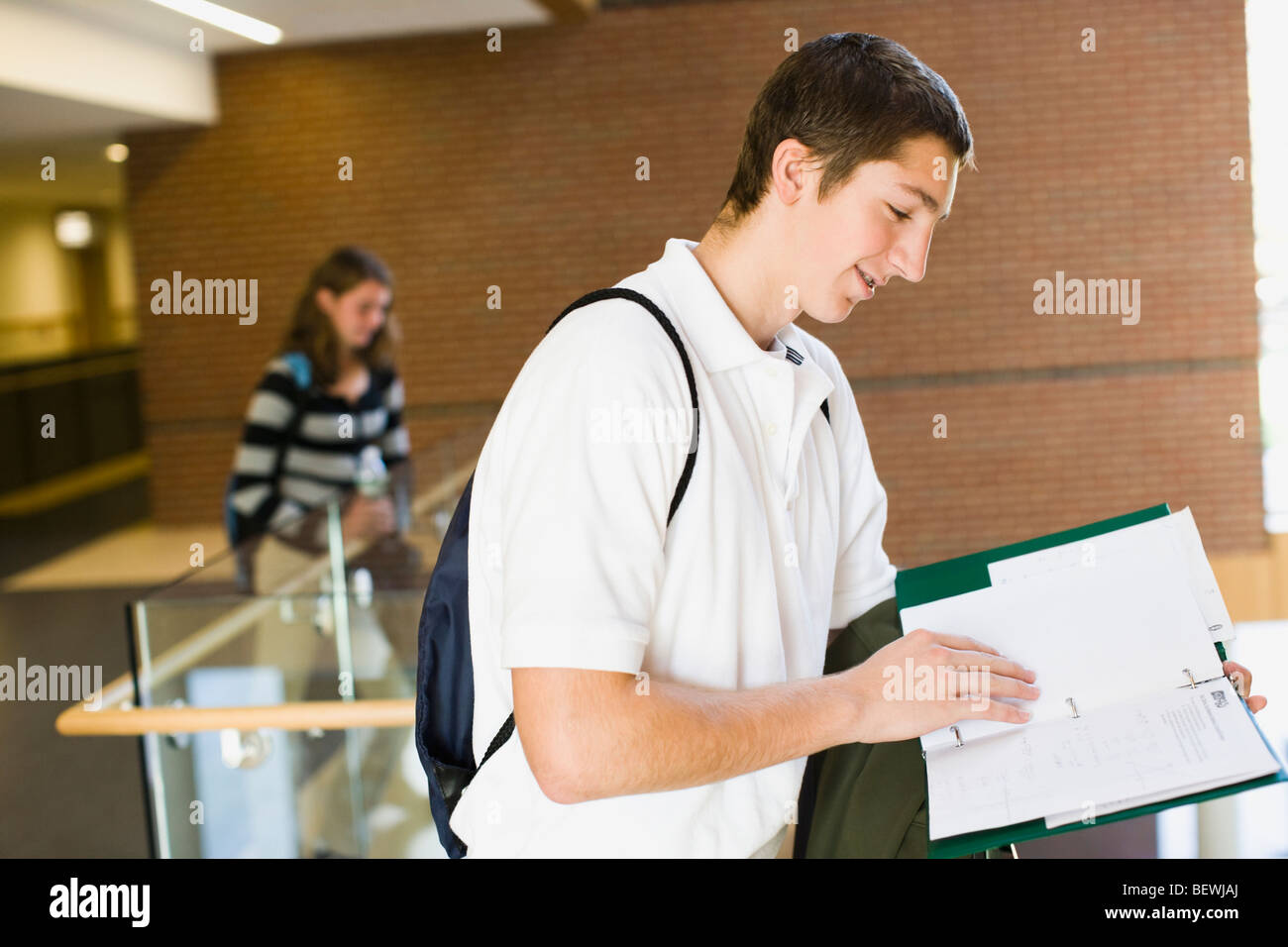 Student reading notes in a campus Stock Photo - Alamy