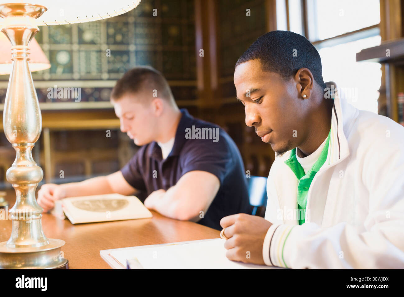 Students reading in a library Stock Photo - Alamy