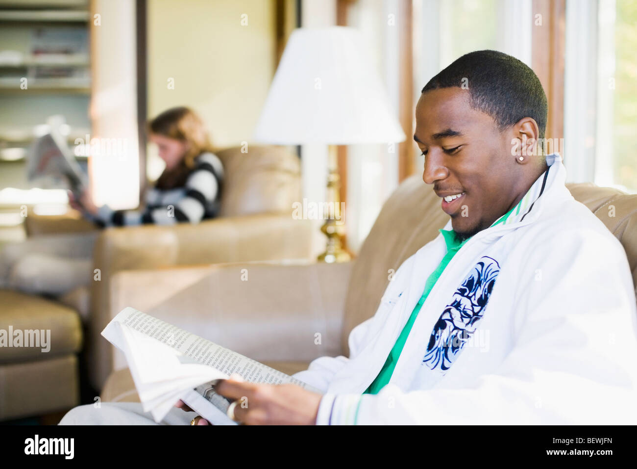Student reading a book Stock Photo - Alamy