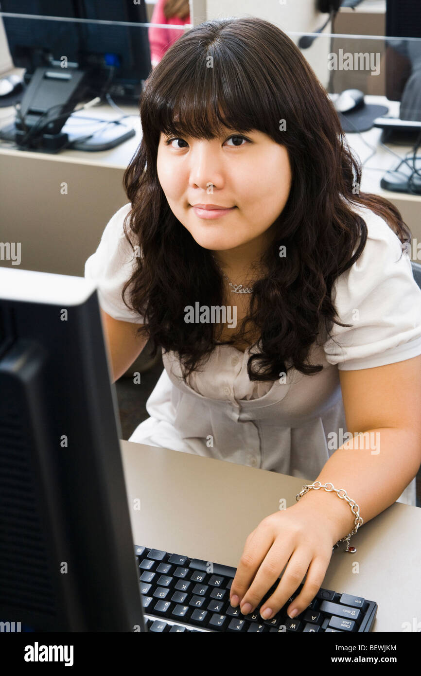 Student sitting in a computer room Stock Photo - Alamy
