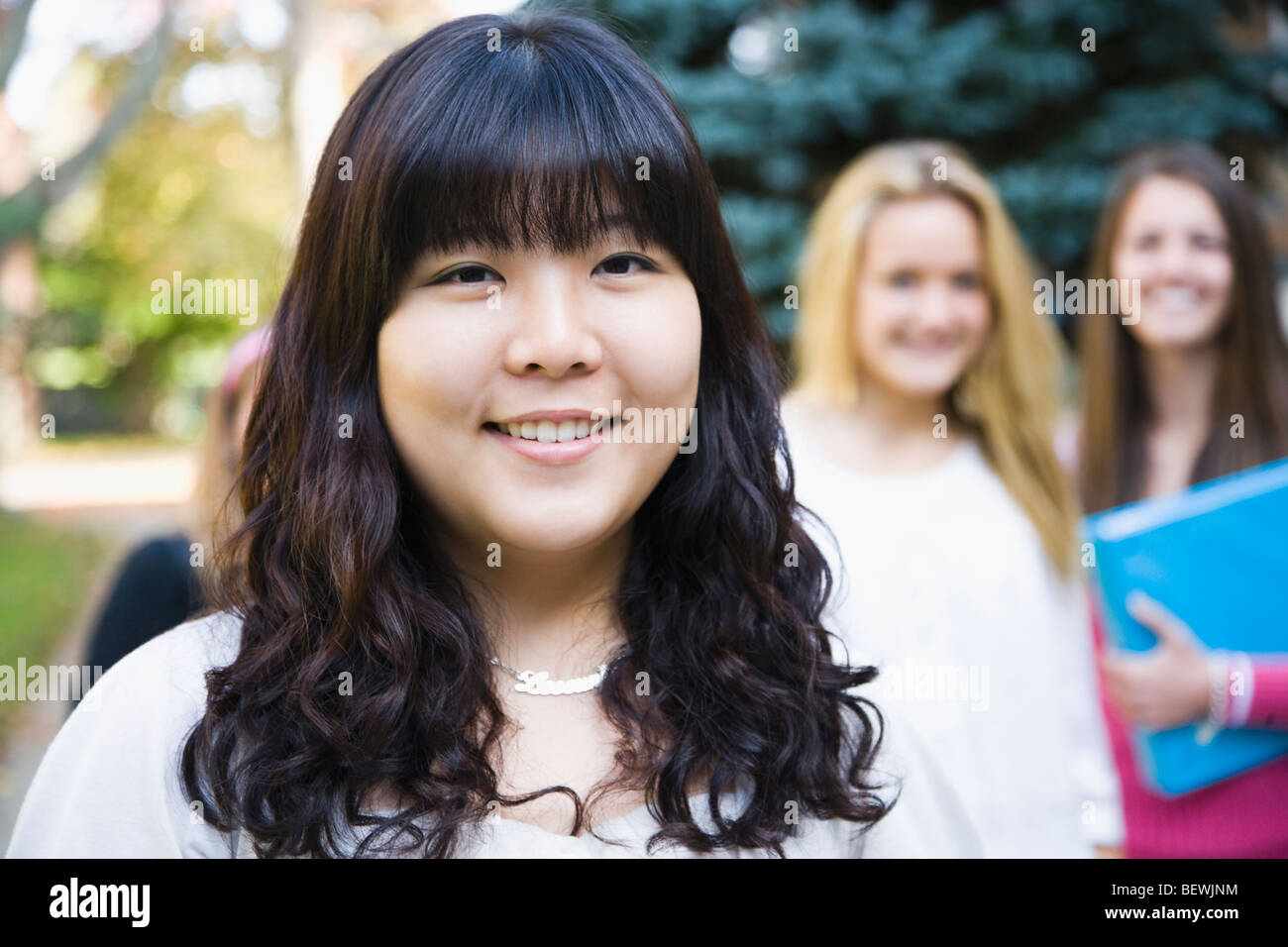 Students smiling in a campus Stock Photo - Alamy