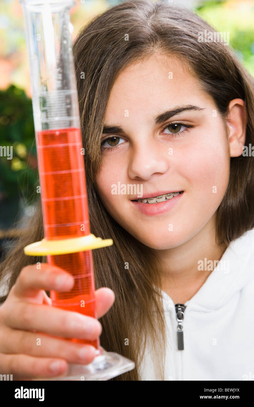 Student doing a scientific experiment in a laboratory Stock Photo - Alamy