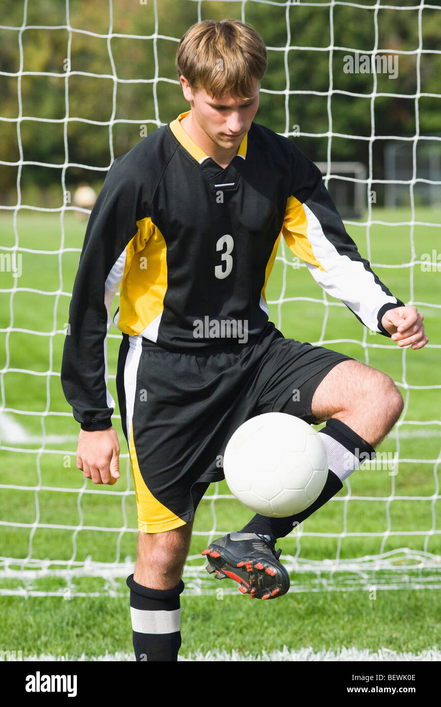 Soccer player playing with a soccer ball Stock Photo - Alamy