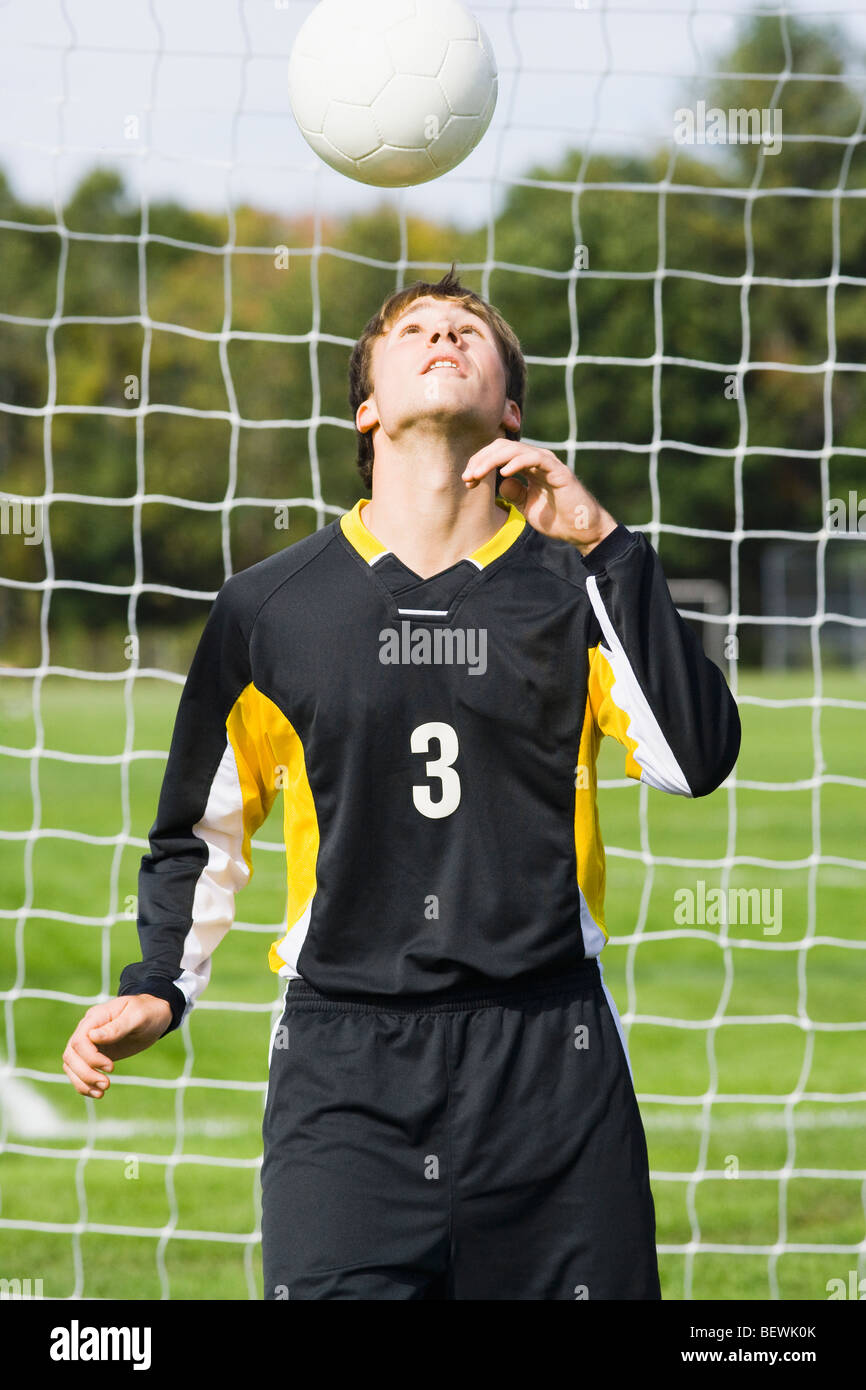 Soccer player playing with a soccer ball Stock Photo - Alamy