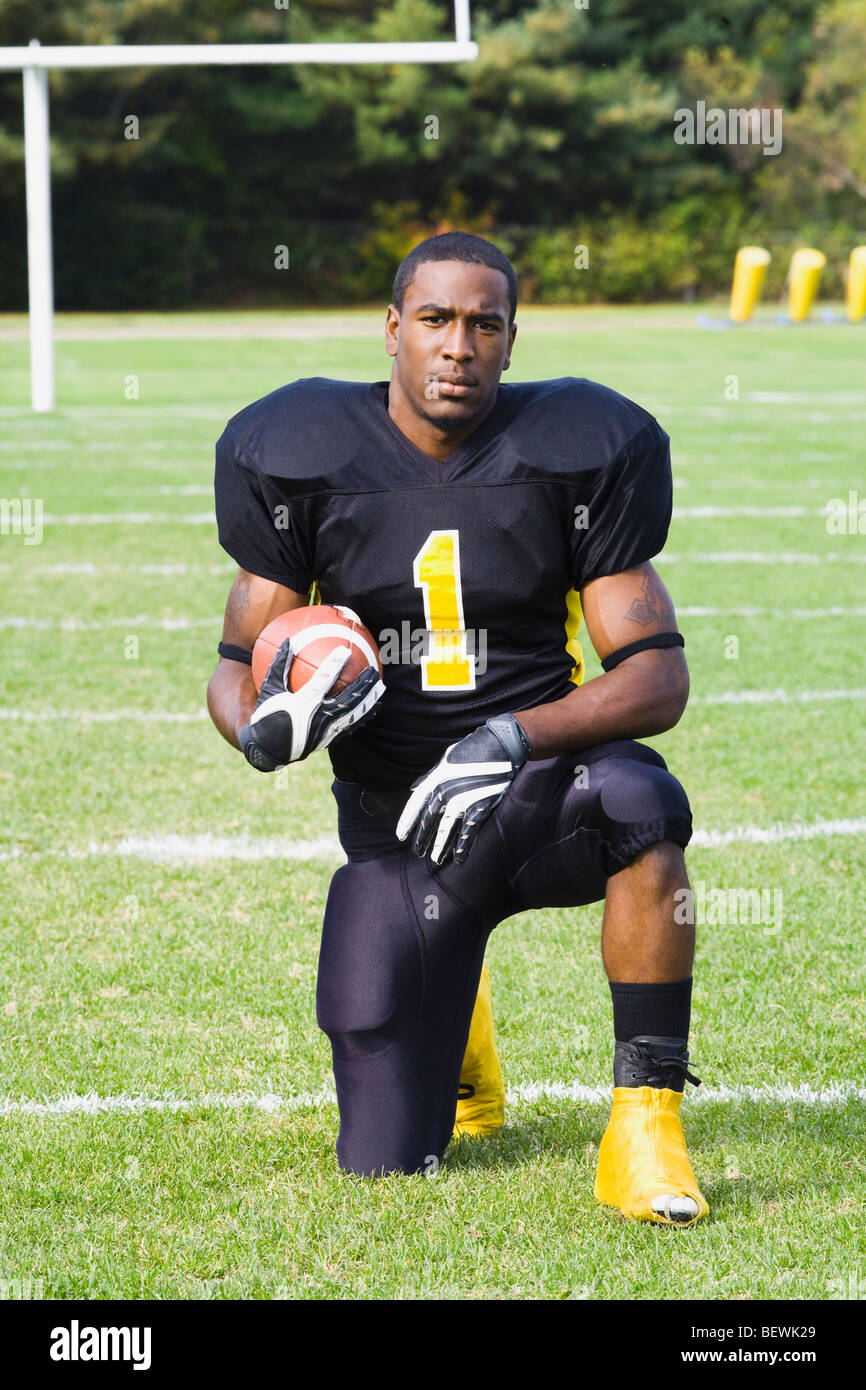 Portrait of a football player in a field Stock Photo - Alamy