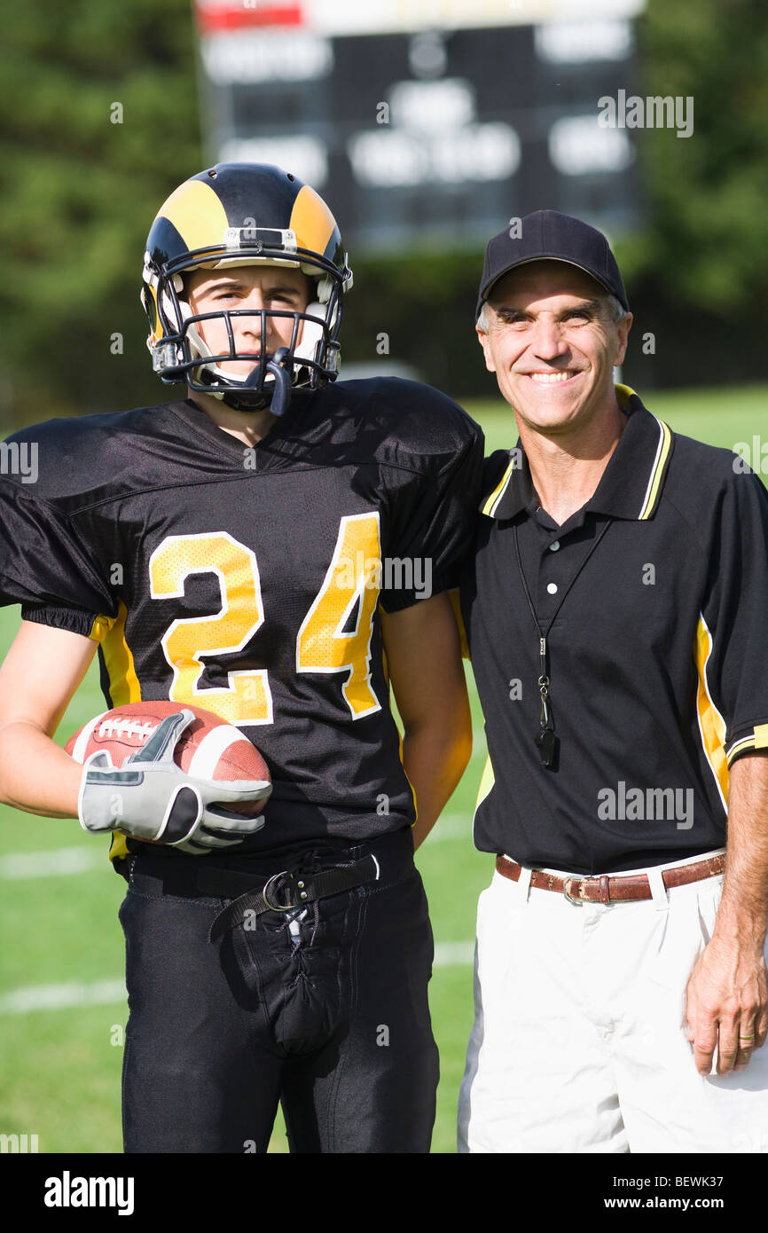 Portrait of a referee standing with a football player Stock Photo - Alamy