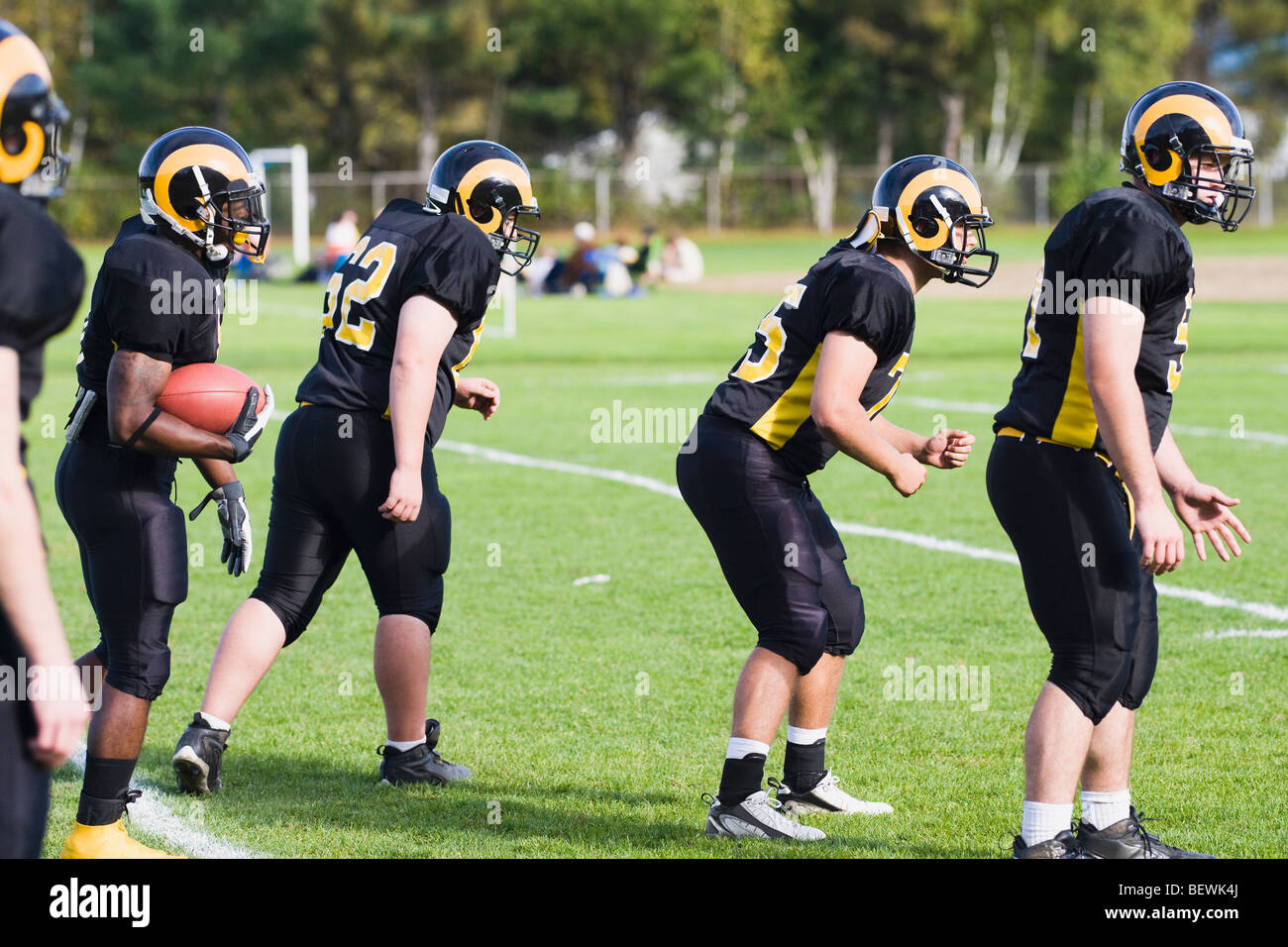 Football players playing in a field Stock Photo - Alamy