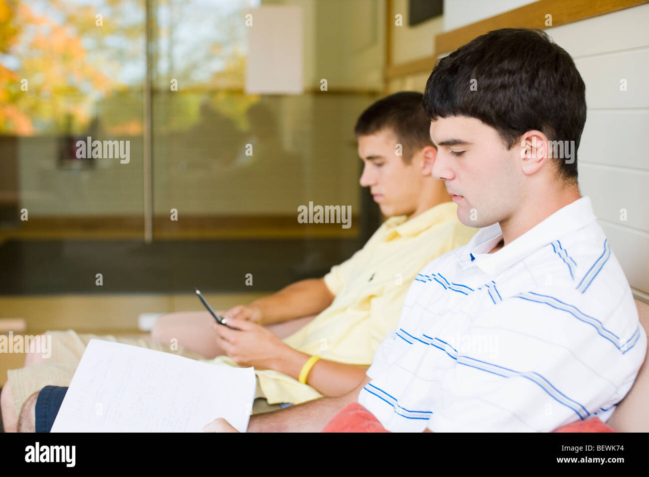 Two students sitting together Stock Photo - Alamy