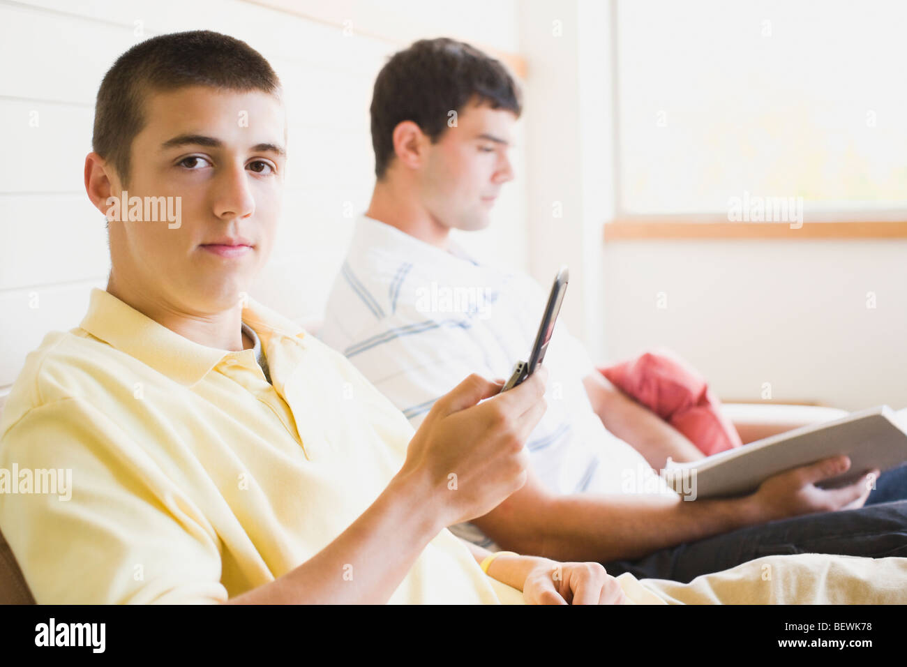 Two students sitting together Stock Photo - Alamy