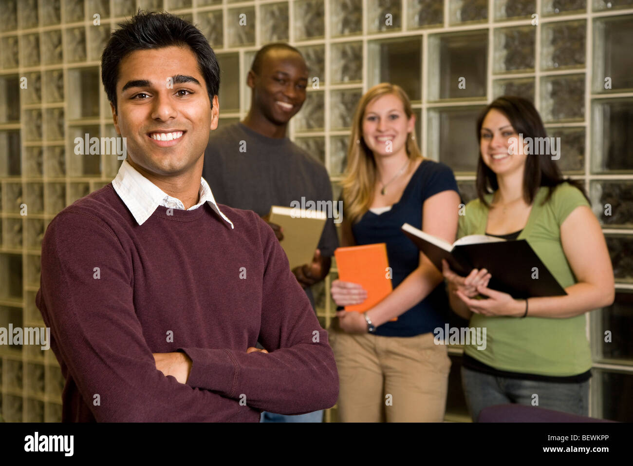 Group of young adults study together in a library Stock Photo - Alamy