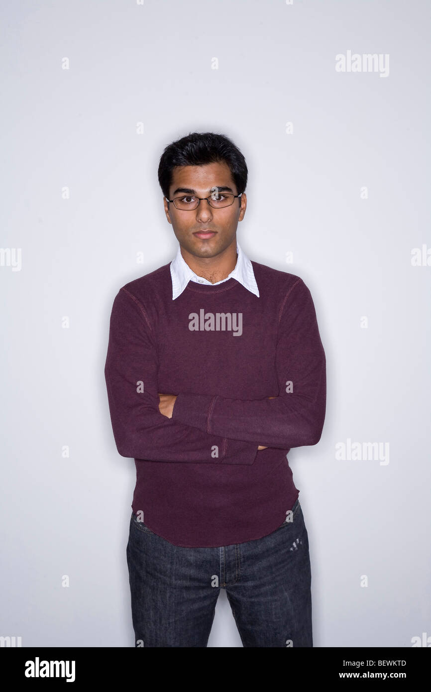 Young man standing alone Stock Photo - Alamy