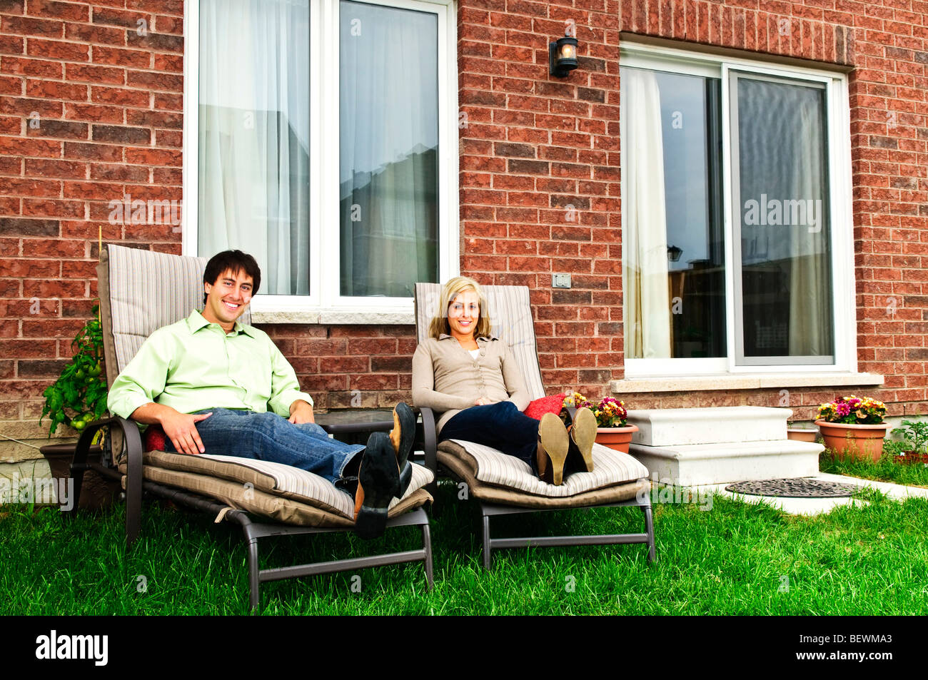Man laying on lounge chair hi-res stock photography and images - Alamy