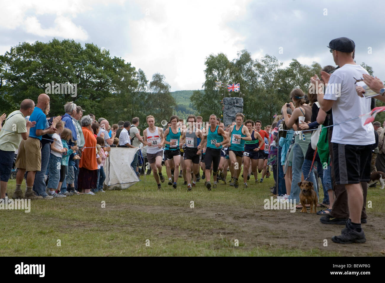 Crowd cheering the runners at the start of the Coniston Old Man fell ...