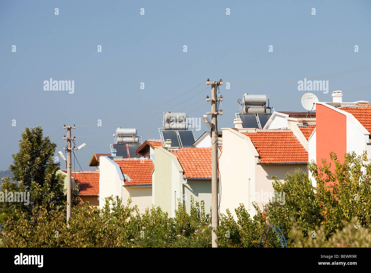 Solar water heaters on house roofs in Teos, Turkey Stock Photo - Alamy