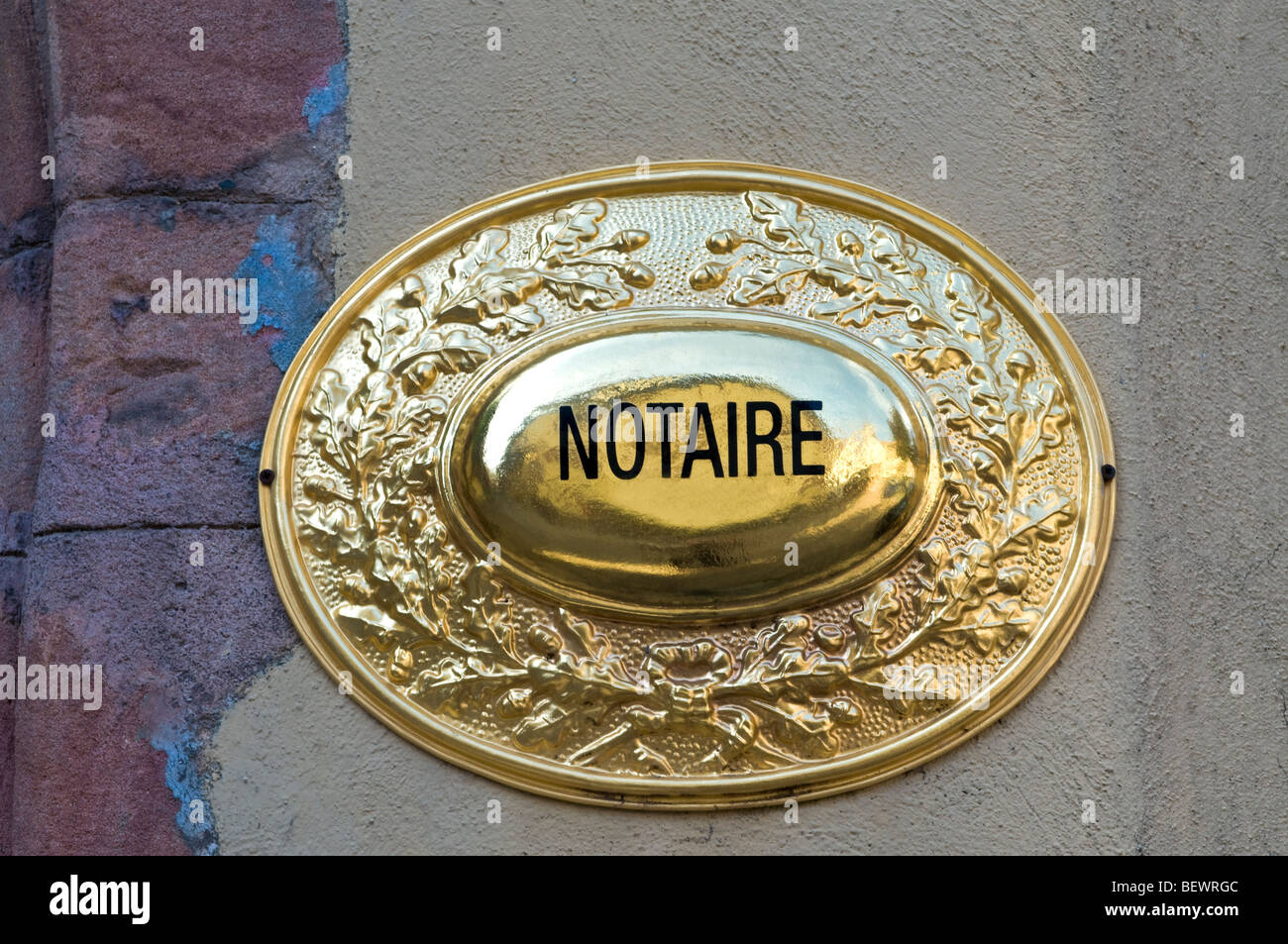 Moulded polished brass plaque sign depicting official french 'Notaire ...