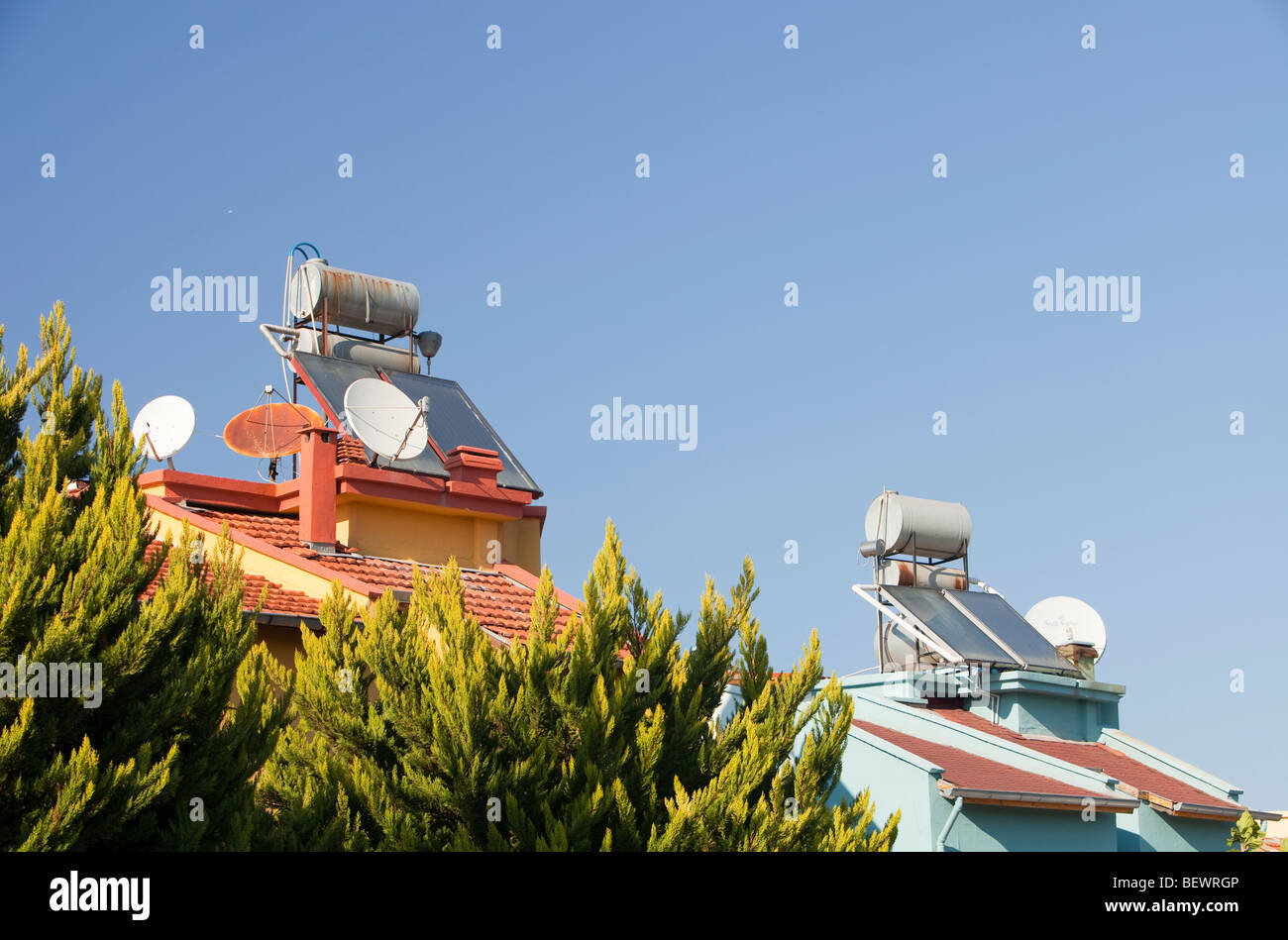 Solar water heaters on houses in Teos, in Western Turkey Stock Photo ...