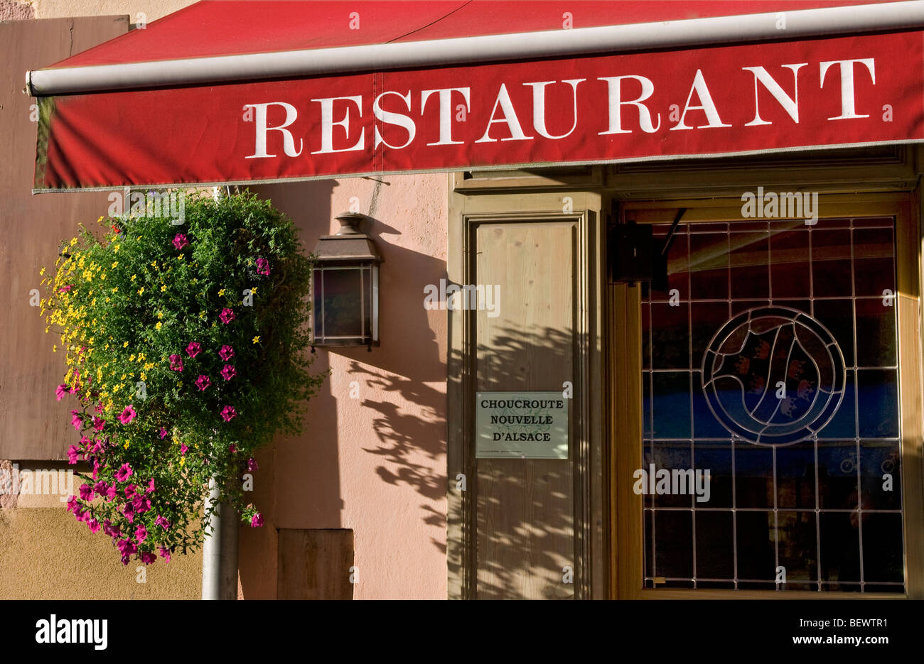 Typical floral colourful exterior of an Alsace restaurant offering ...