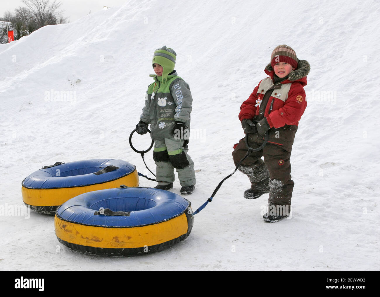 children at bottom of slide at tubing run at snow play park on Plains ...