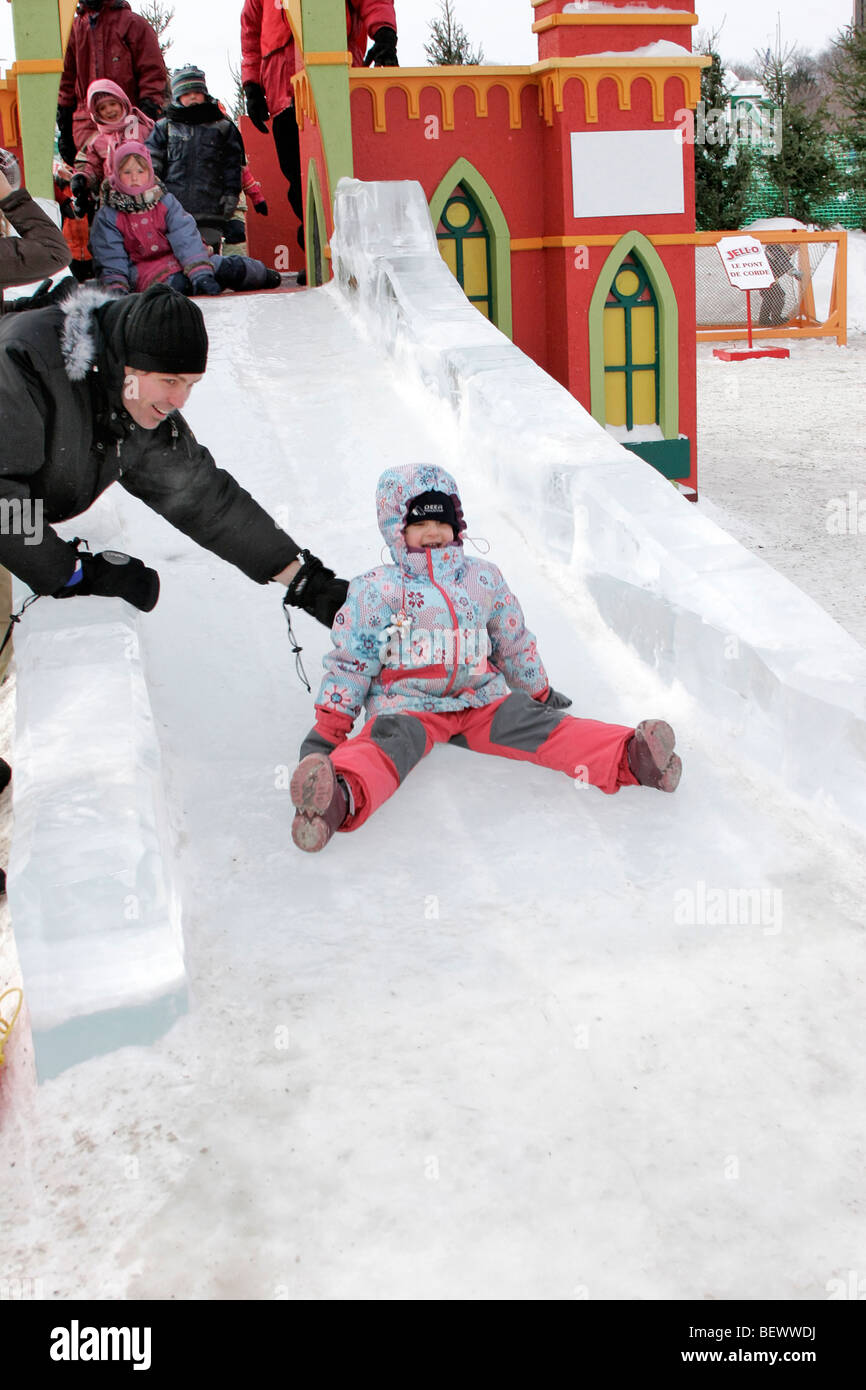 Children on ice slide at snow play area on Plains of Abraham at Quebec ...