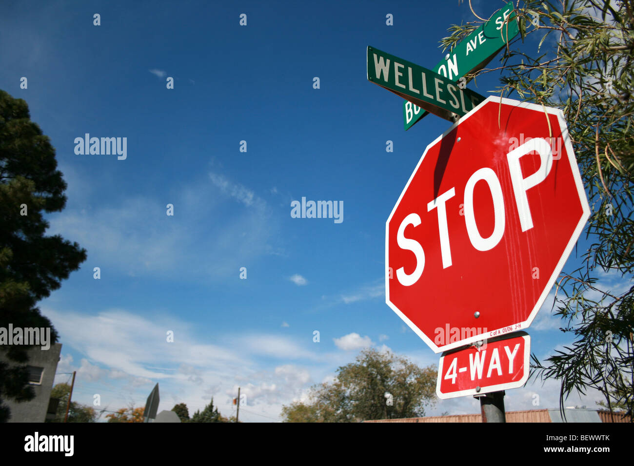 4 way Four way stop sign at intersection, residential neighborhood ...