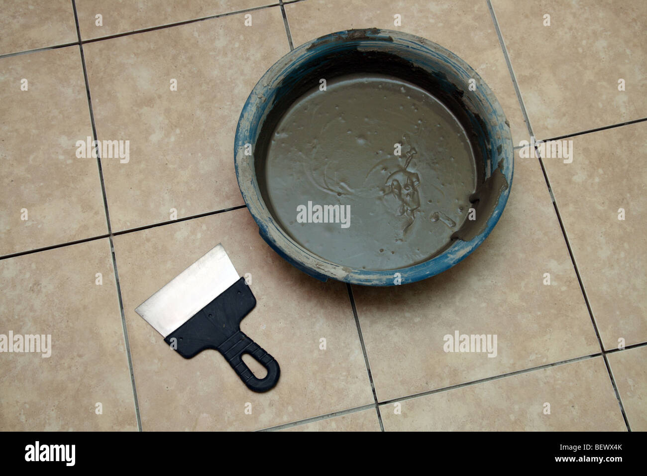 construction works - ceramics brick laying on floor Stock Photo - Alamy
