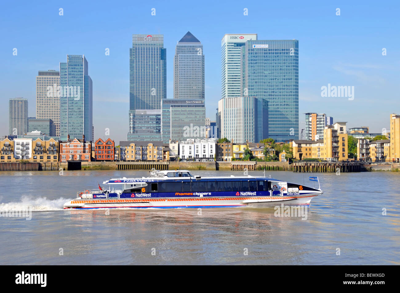 Thames clipper fast catamaran river waterbus service passing Canary ...