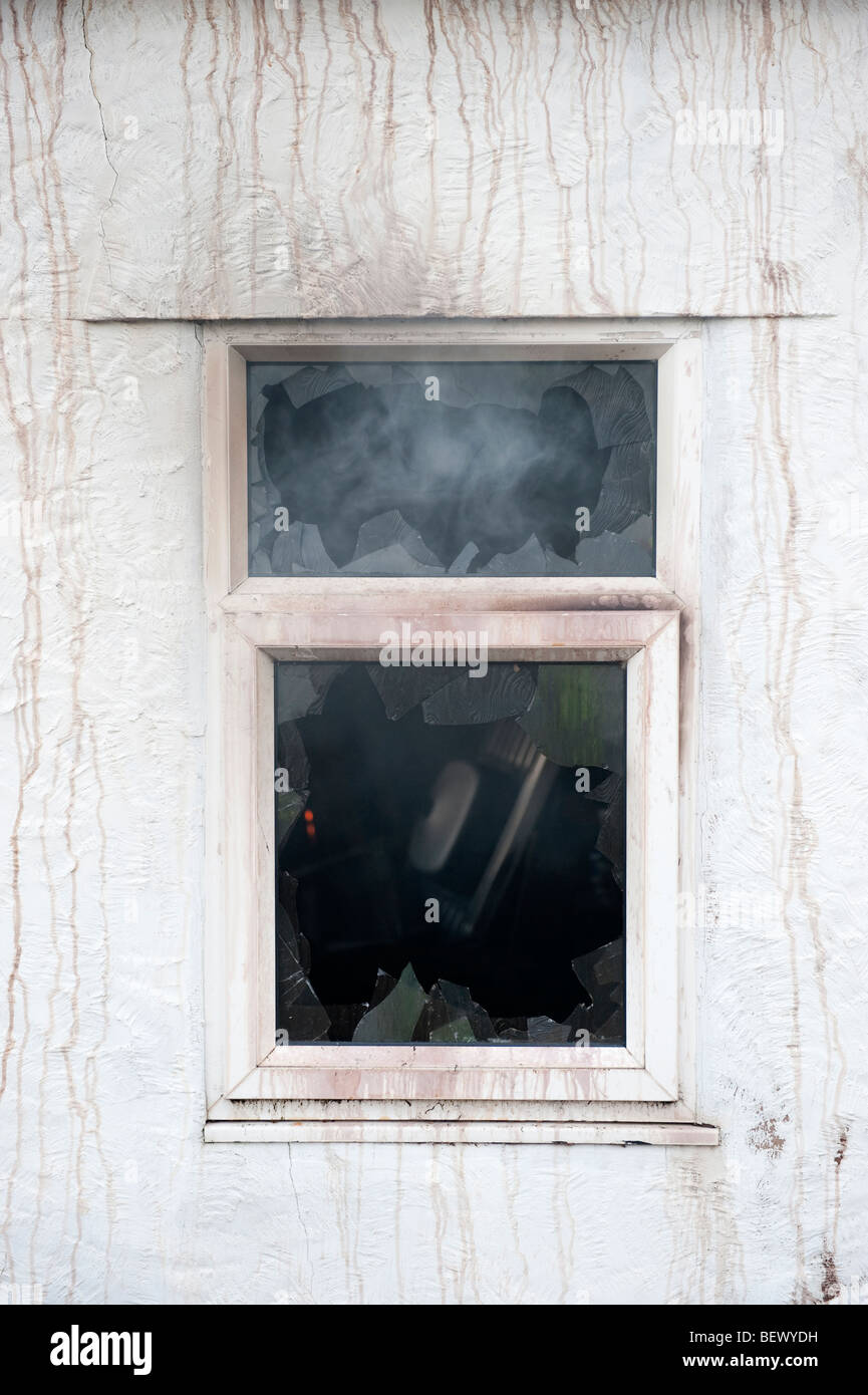 Smoke coming through window from kitchen fire at house Stock Photo - Alamy